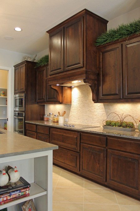 Burrows Cabinets' kitchen in knotty alder - Georgian vent hood
